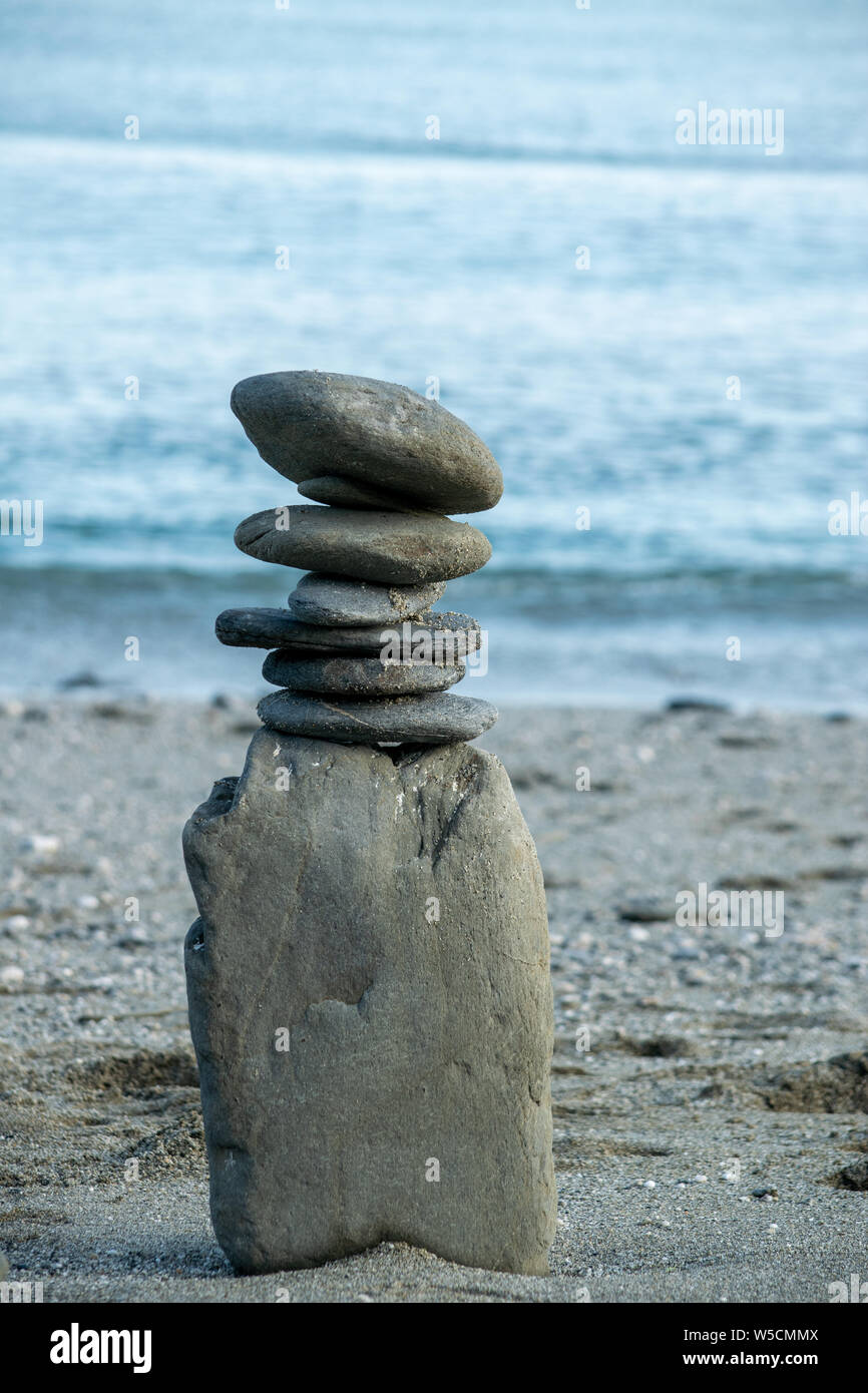 Balancing Rocks On The Beach