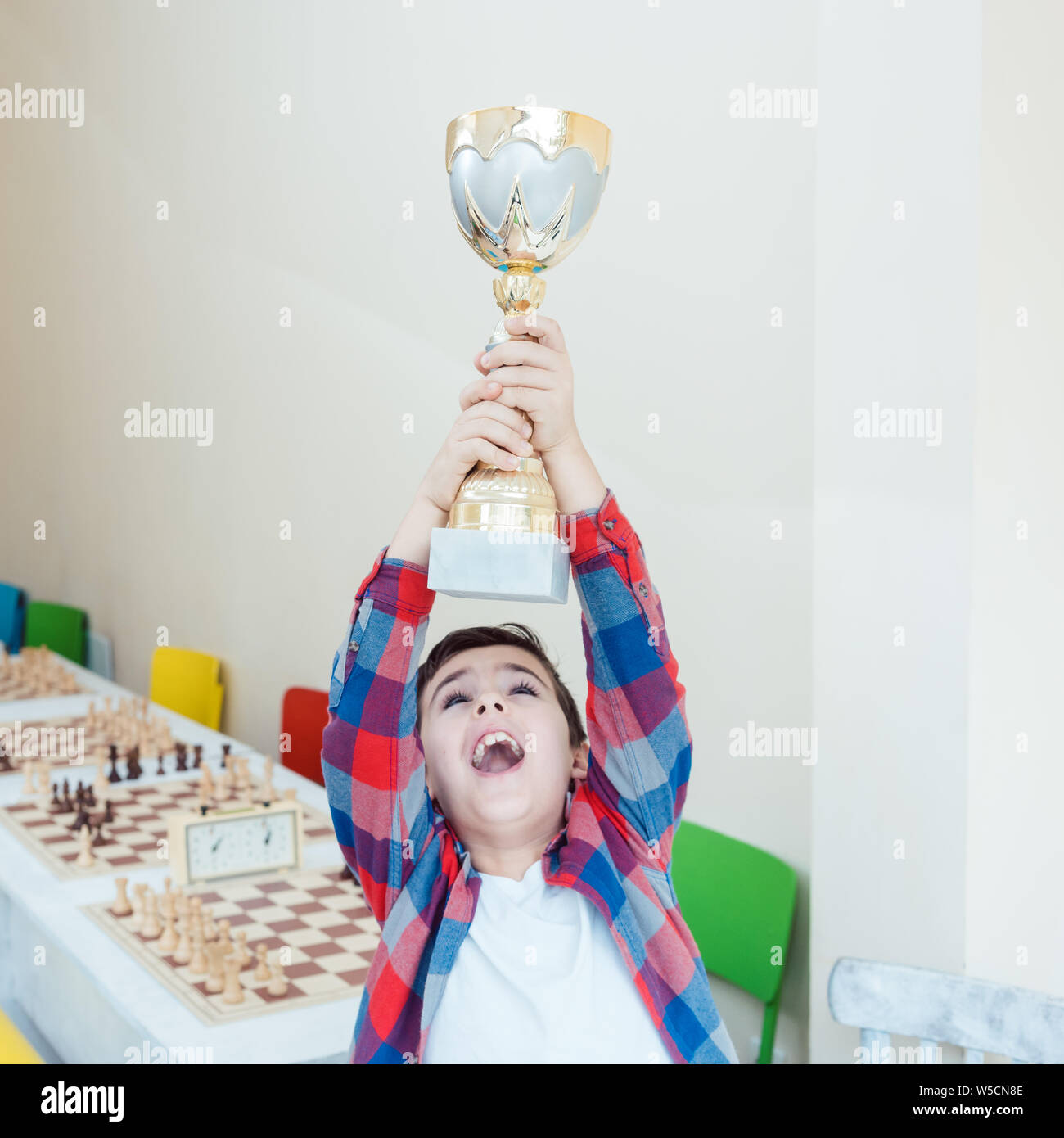 Child winner trophy hi-res stock photography and images - Alamy