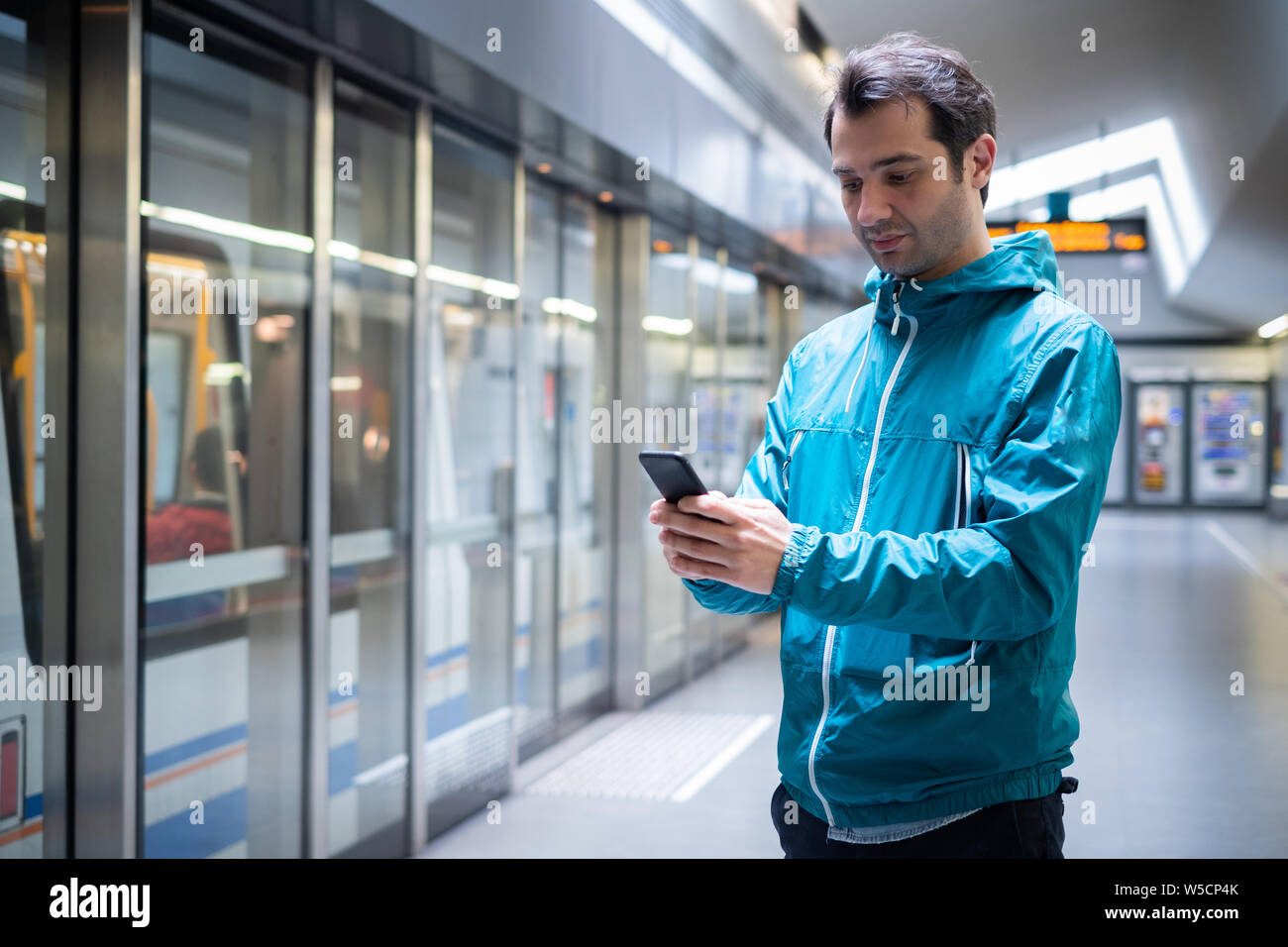 Reading smartphone public transport hi-res stock photography and images ...