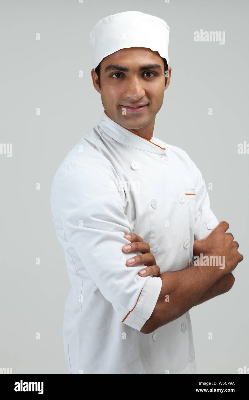 Portrait of a chef with his arms crossed Stock Photo - Alamy