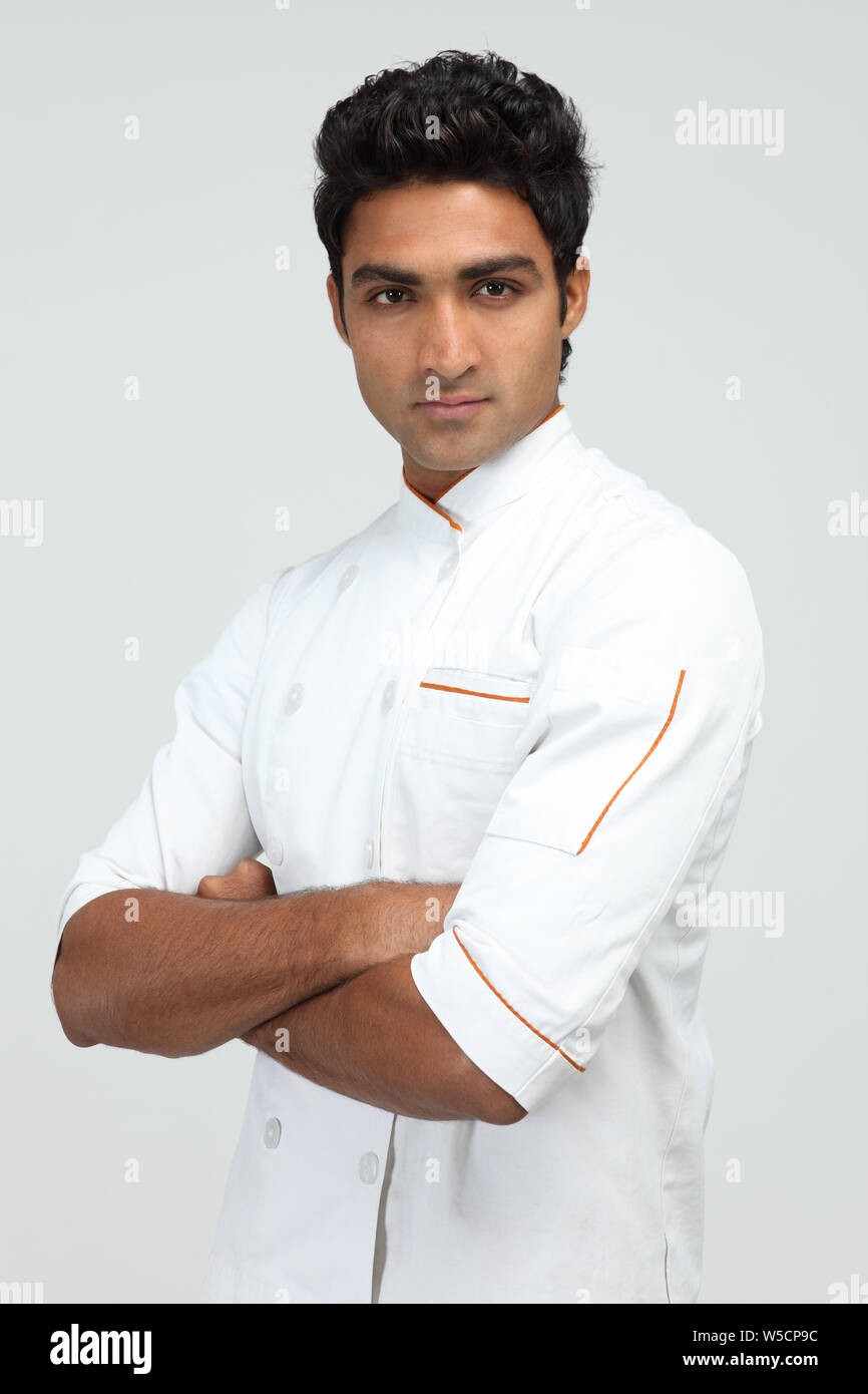 Portrait of a chef with his arms crossed Stock Photo - Alamy