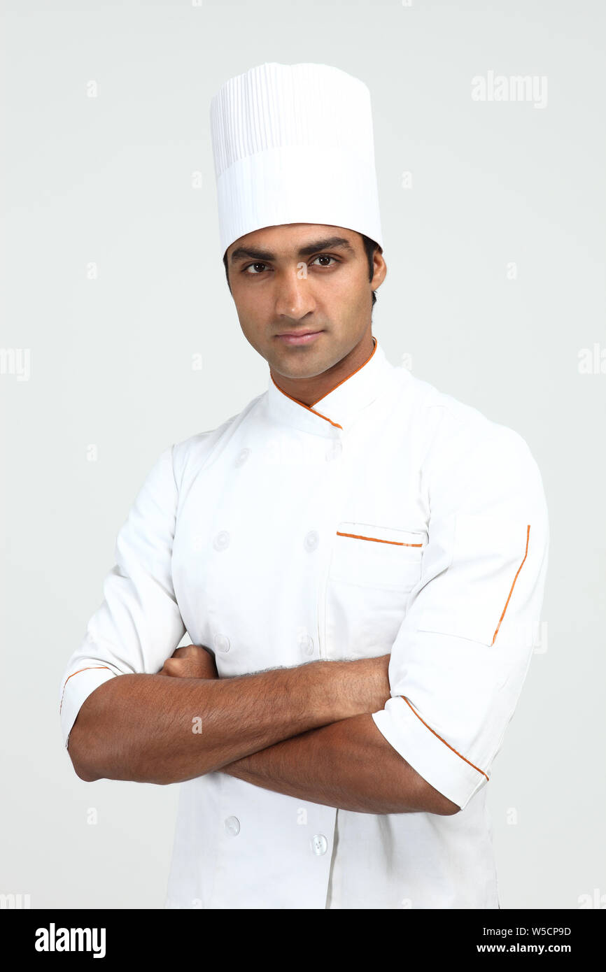 Portrait of a chef with his arms crossed Stock Photo - Alamy