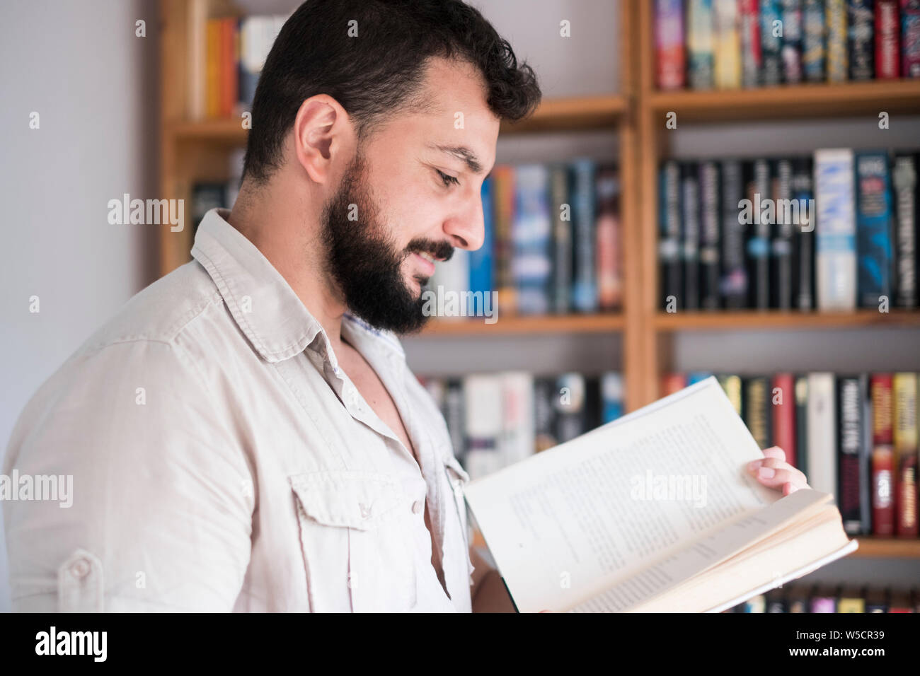 Bearded man reading book hi-res stock photography and images - Alamy