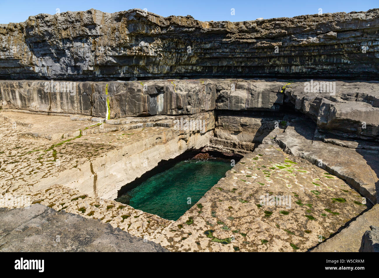 Cliffs and worm hole in Inishmore, Aran Islands, Ireland Stock Photo ...