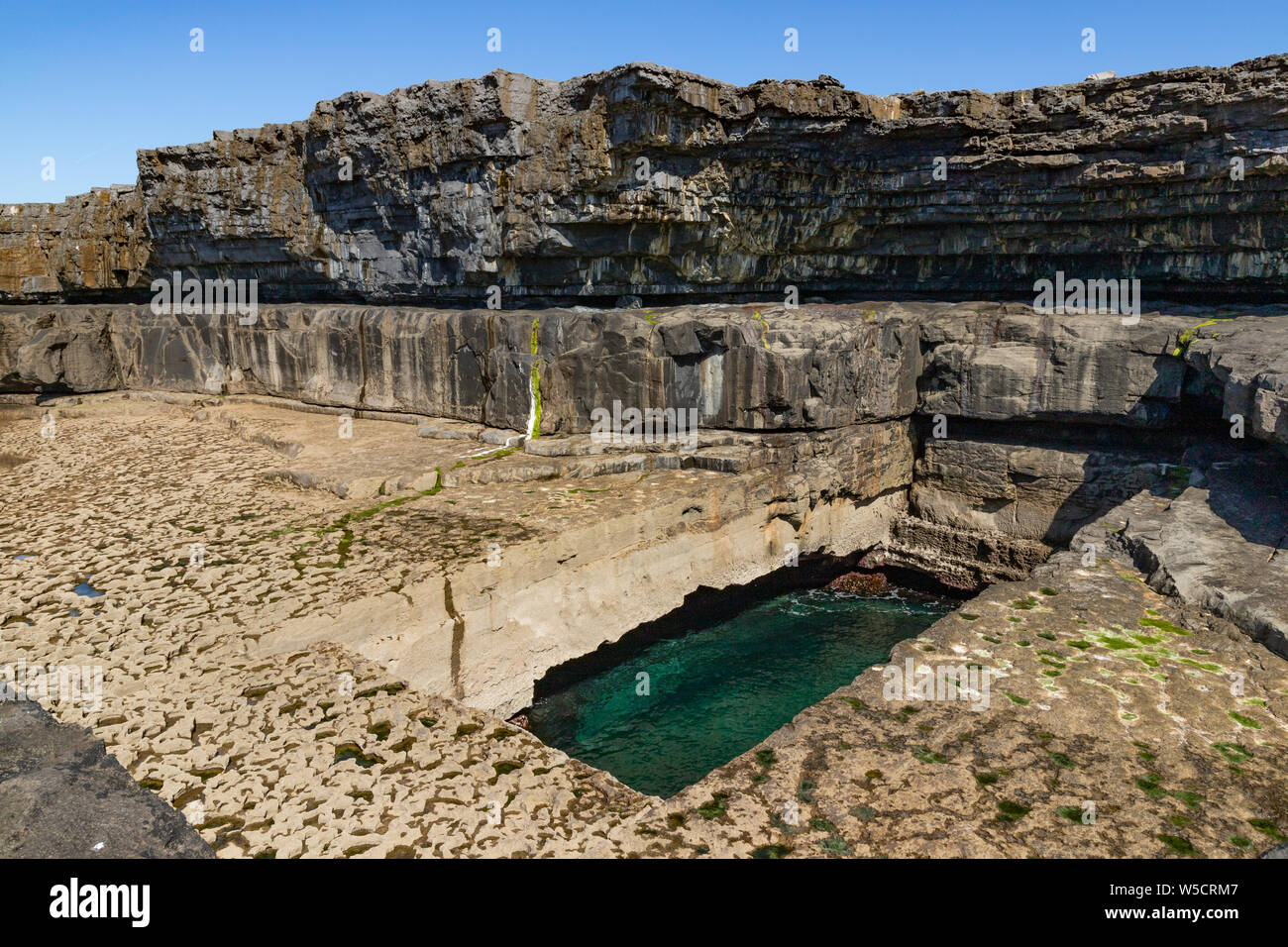 Cliffs and worm hole in Inishmore, Aran Islands, Ireland Stock Photo ...