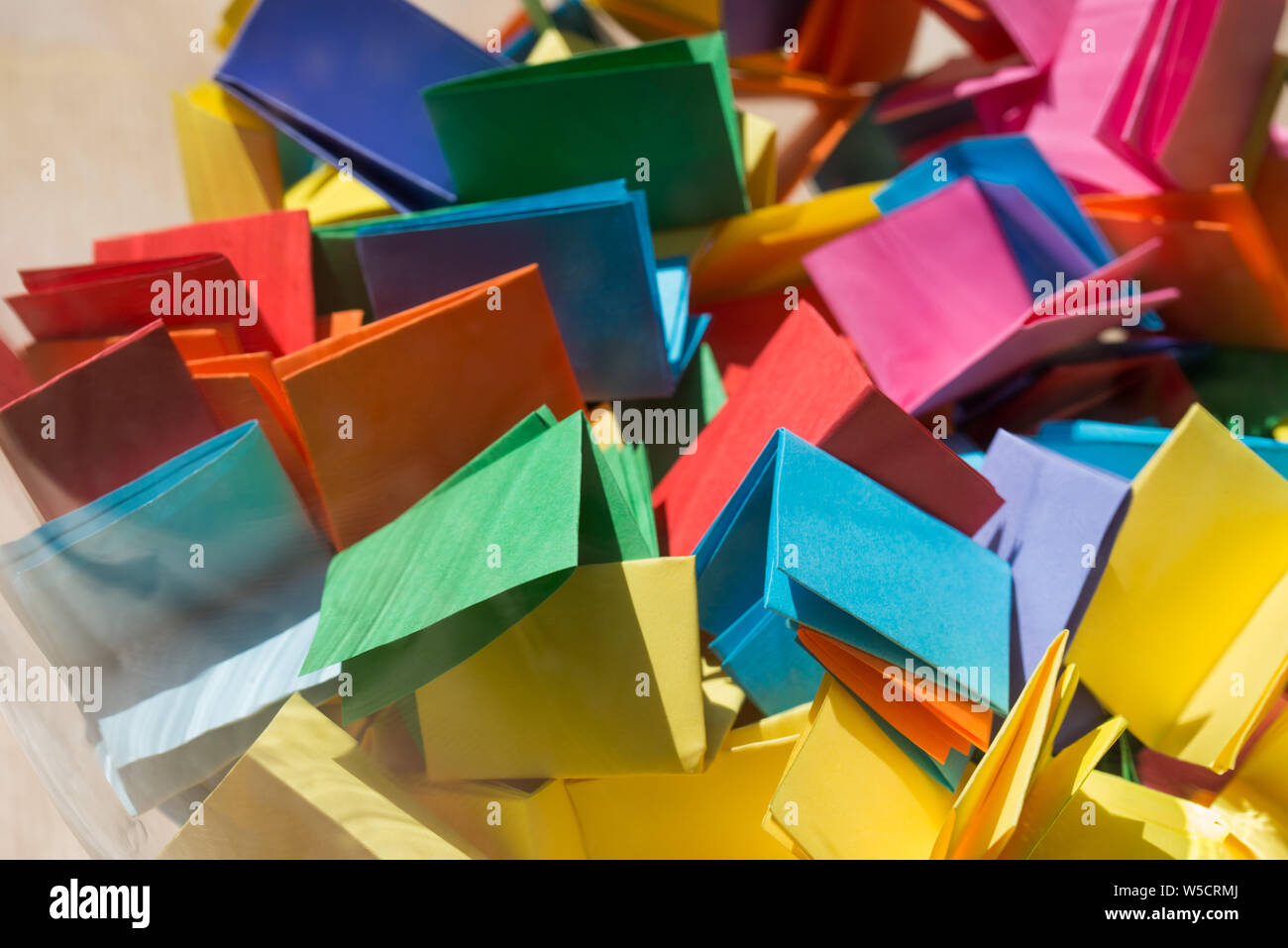 multicolored lottery tickets in jar closeup Stock Photo - Alamy