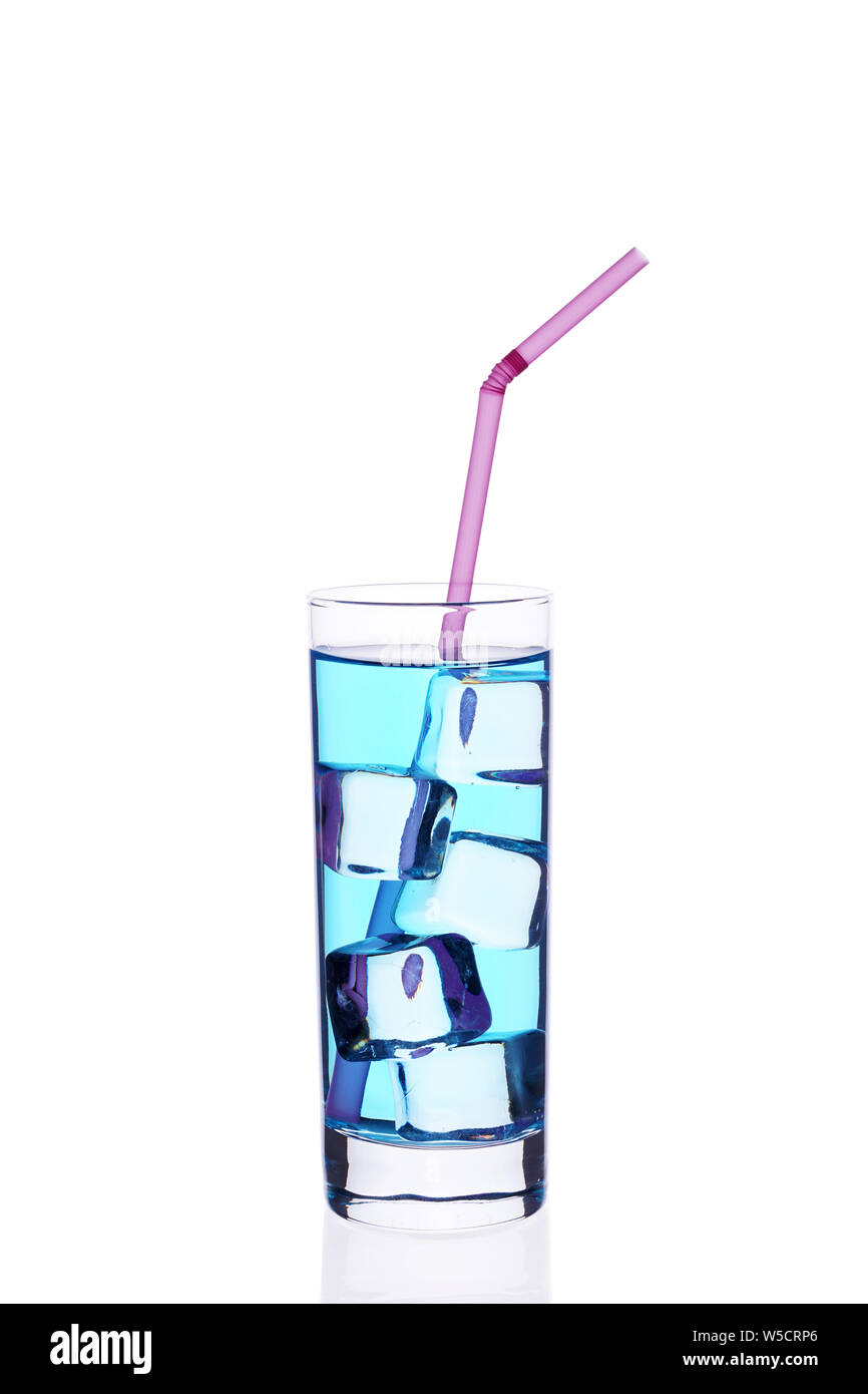 A glass cup of blue cocktail c tube ice cubes on a white background ...