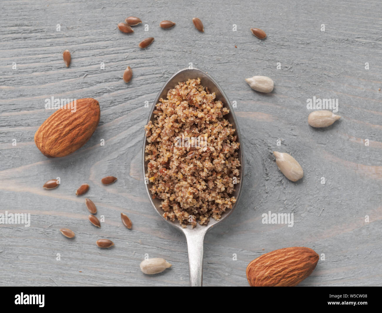 Homemade LSA mix in spoon - Linseed or flax seeds, Sunflower seeds and ...