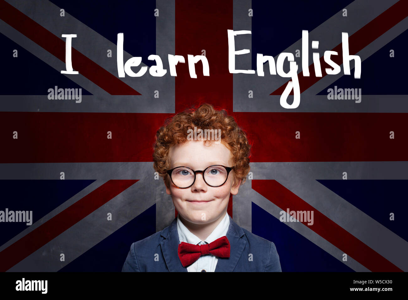 Successful child boy student against the UK flag background. Learn ...