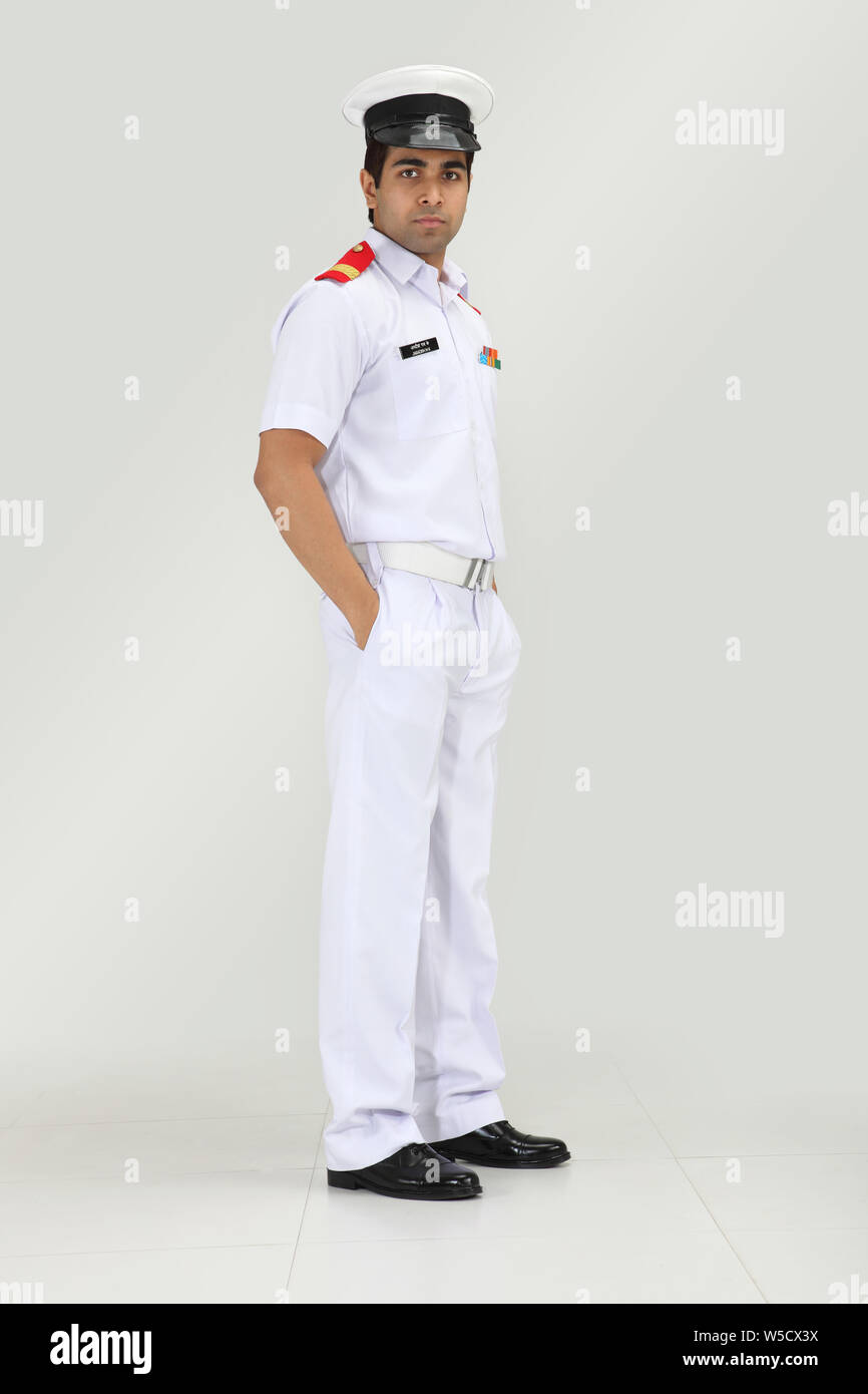 Navy officer standing with his hands in pockets Stock Photo - Alamy