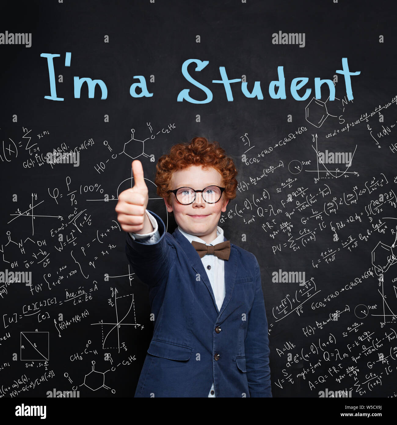 Happy student in school uniform showing thumb up and smiling. Back to ...