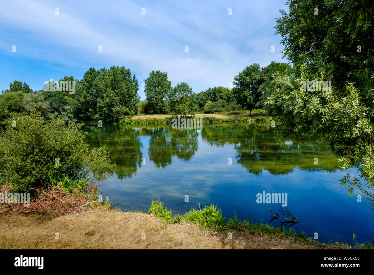 The River Eure, a tributary of the Seine, in Pont-de-l'Arche, Normandy ...