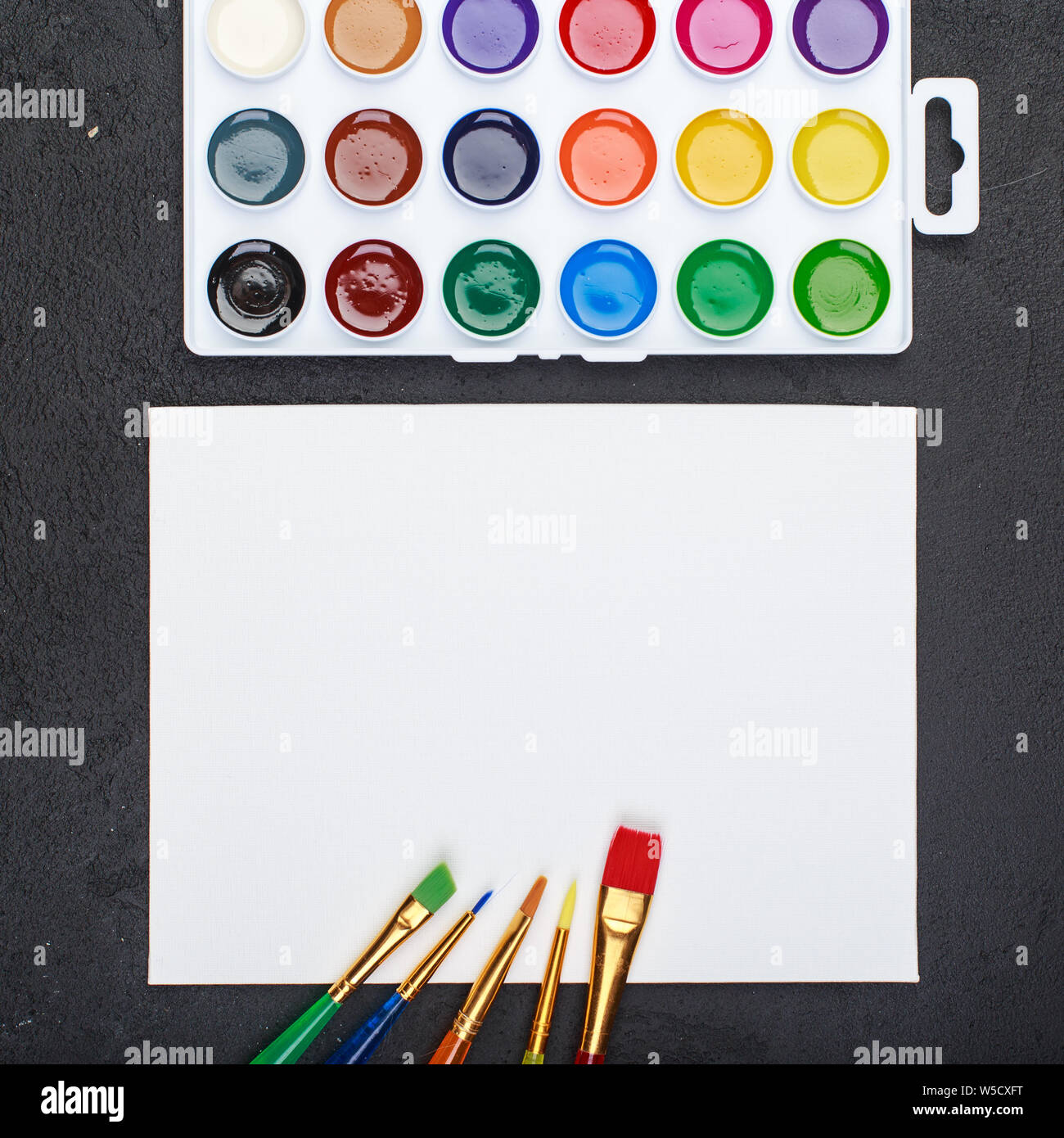 Blank paper and colorful paint top view from above Stock Photo - Alamy