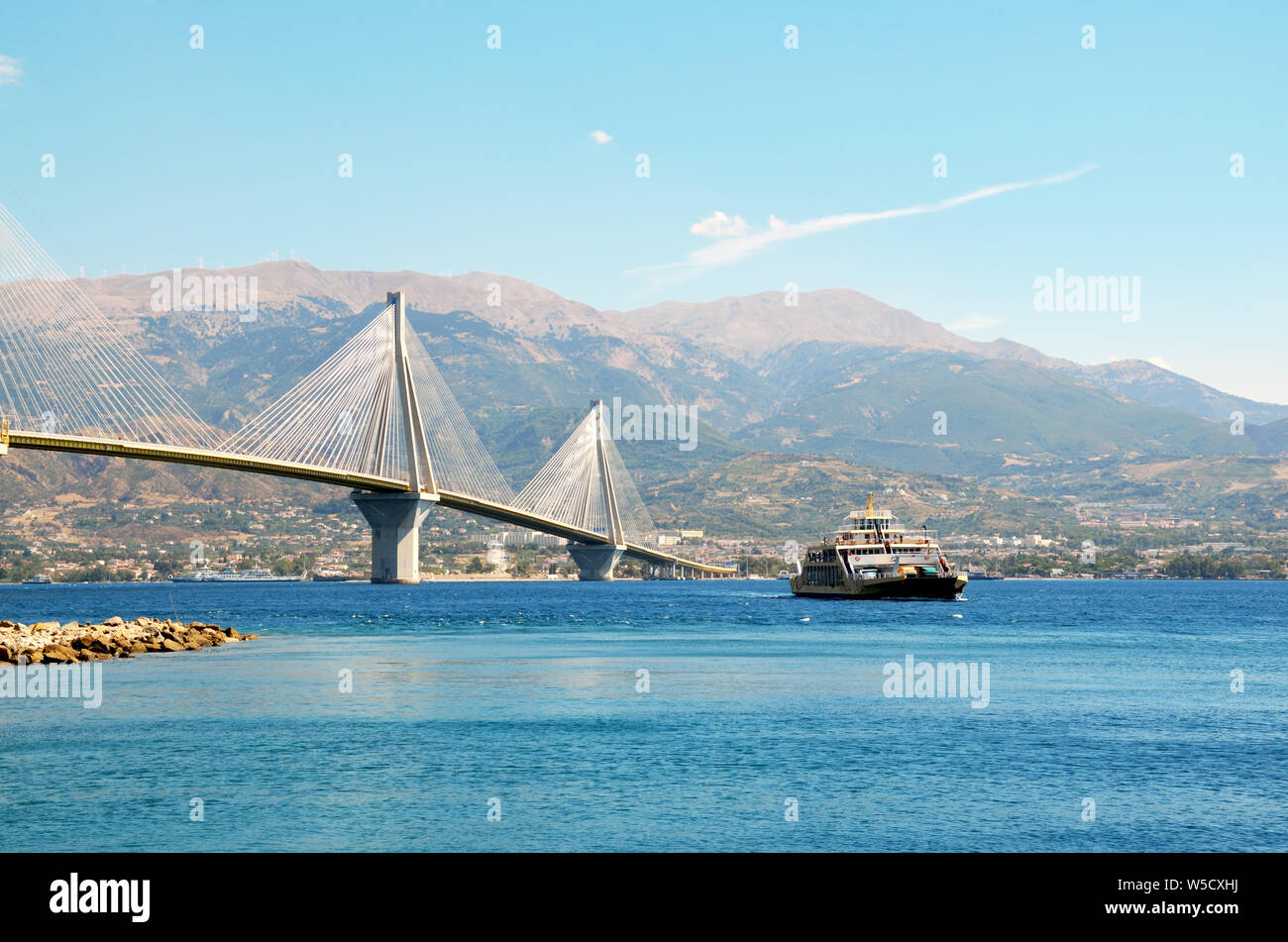 Rio -Antirio, cable-stayed bridge and ferry boat Stock Photo - Alamy