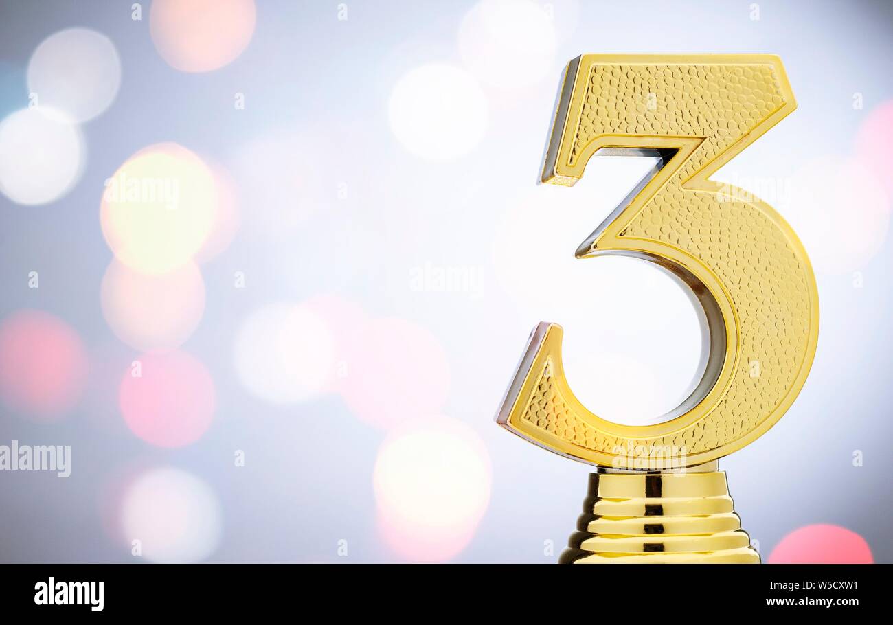 3rd placed runner up metallic gold trophy with a 3D number 3 on white ...