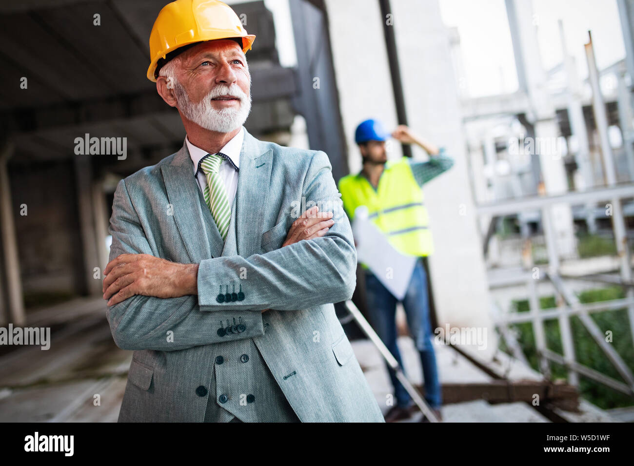 Construction engineers discussion with architects at construction or ...