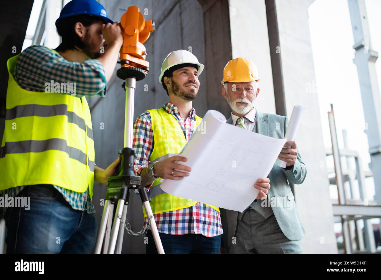 Group of construction engineer working in construction site Stock Photo ...