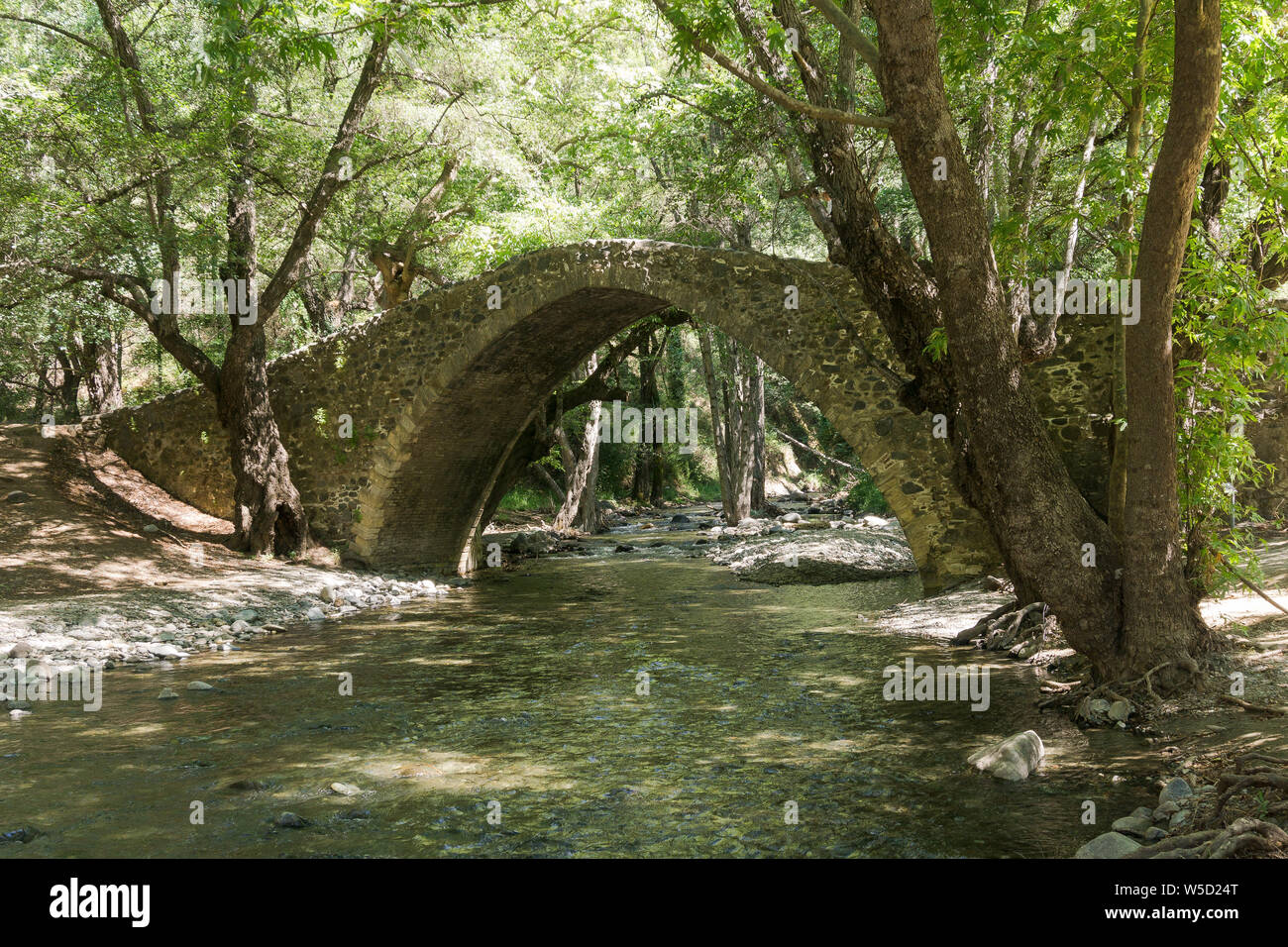 the Venetian stone bridge of Tzelefos in Cyprus with creek Stock Photo ...