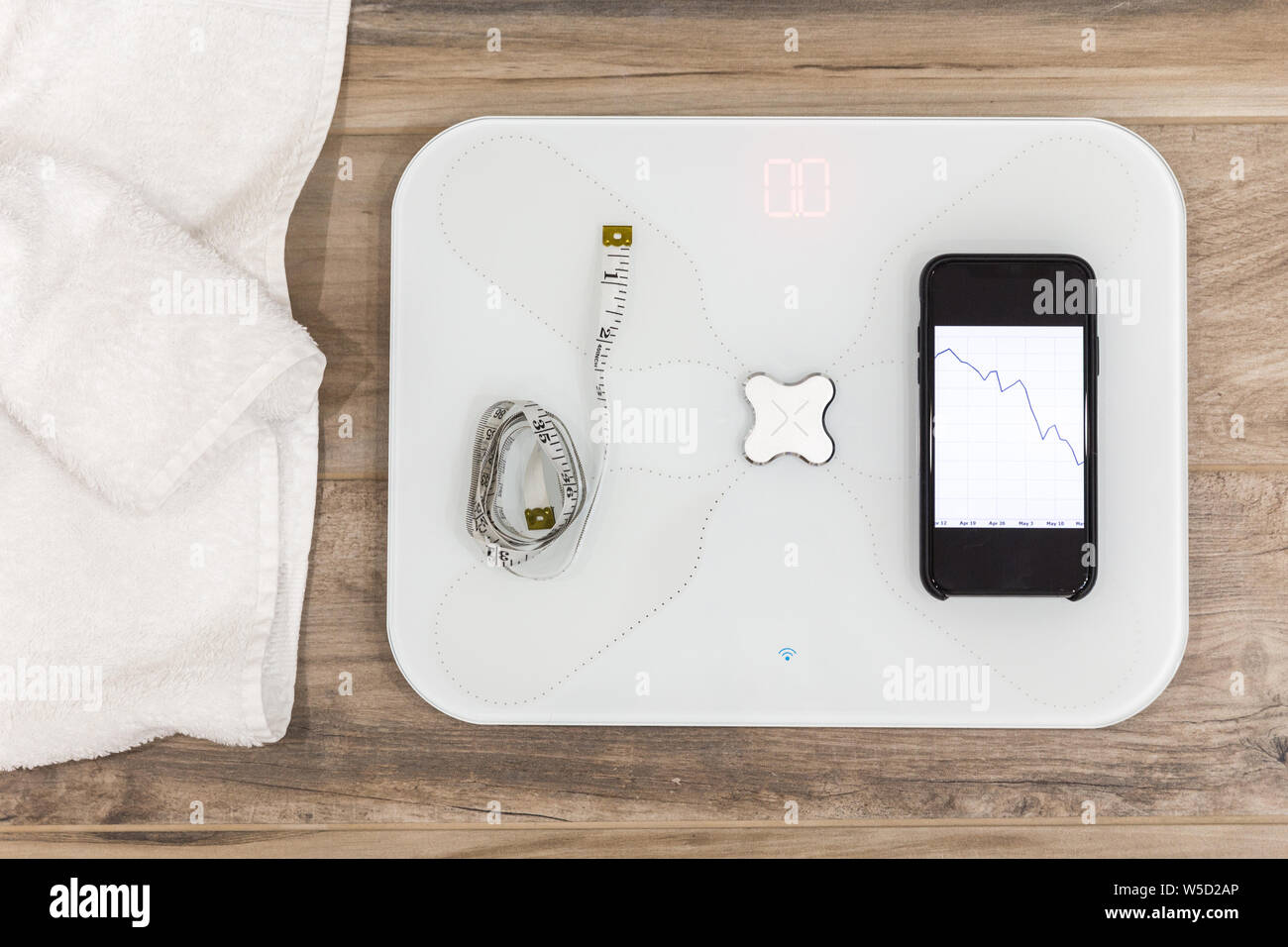 Smart scale standing on a floor connected to smartphone Stock Photo - Alamy