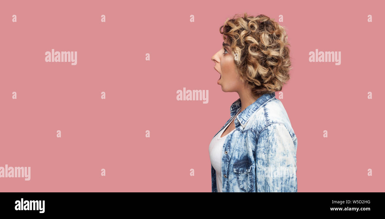Profile side view portrait of shocked young woman with curly hairstyle ...
