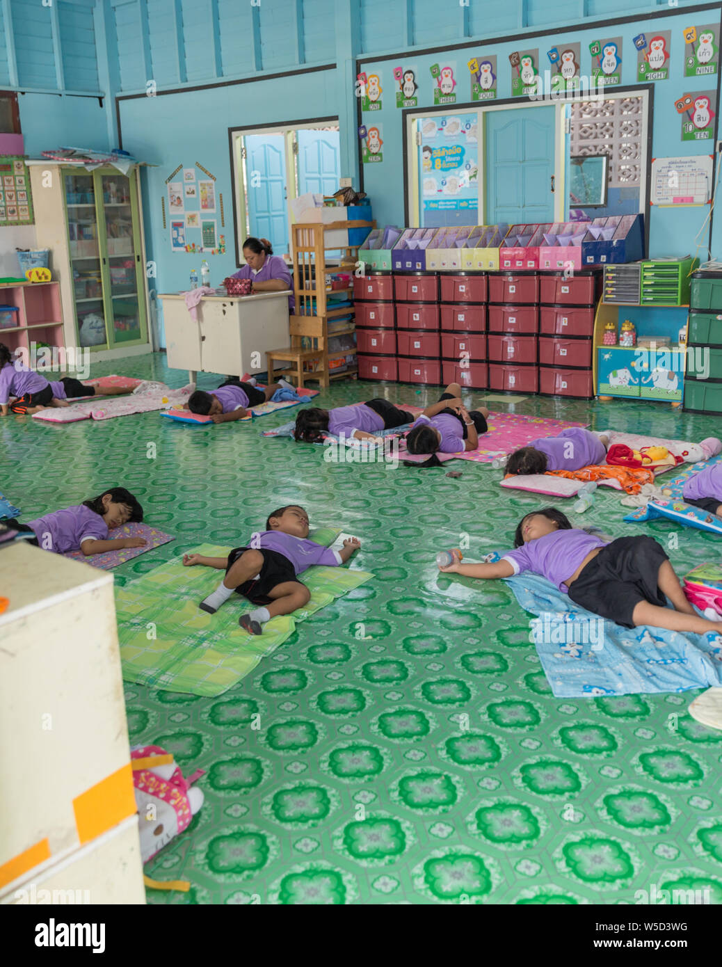 THAILAND, PHUKET - JANUARY 10, 2018 - Children sleeping on floor in ...