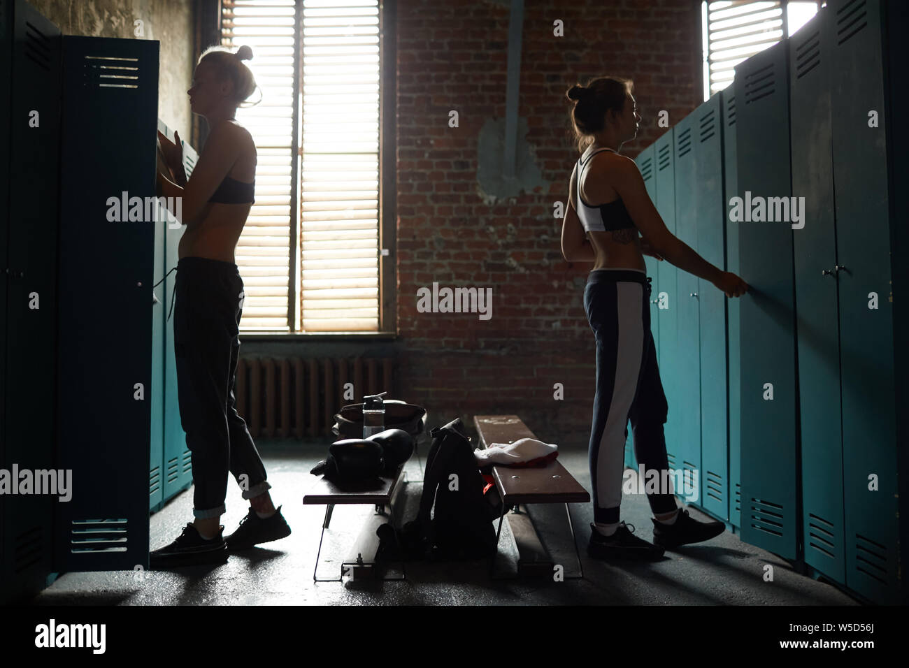 Changing clothes woman locker room hi-res stock photography and images ...