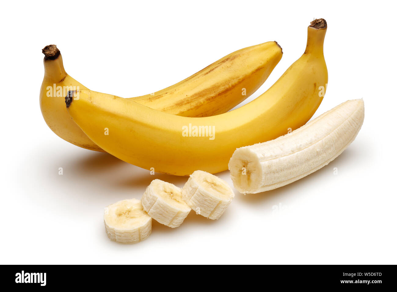 Whole and sliced ripe bananas isolated on white background Stock Photo ...
