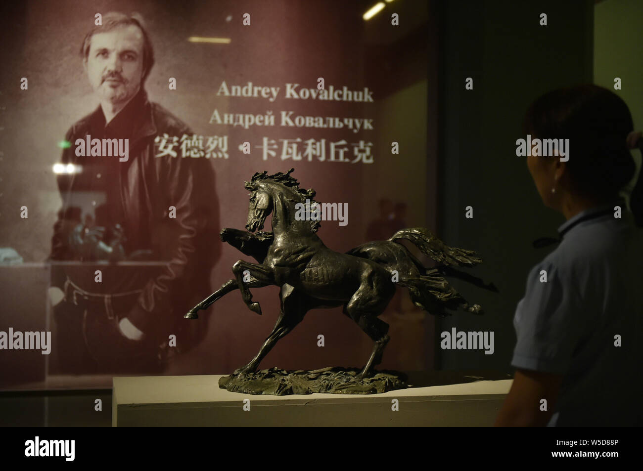 Beijing, China. 28th July, 2019. A visitor views a sculpture work ...