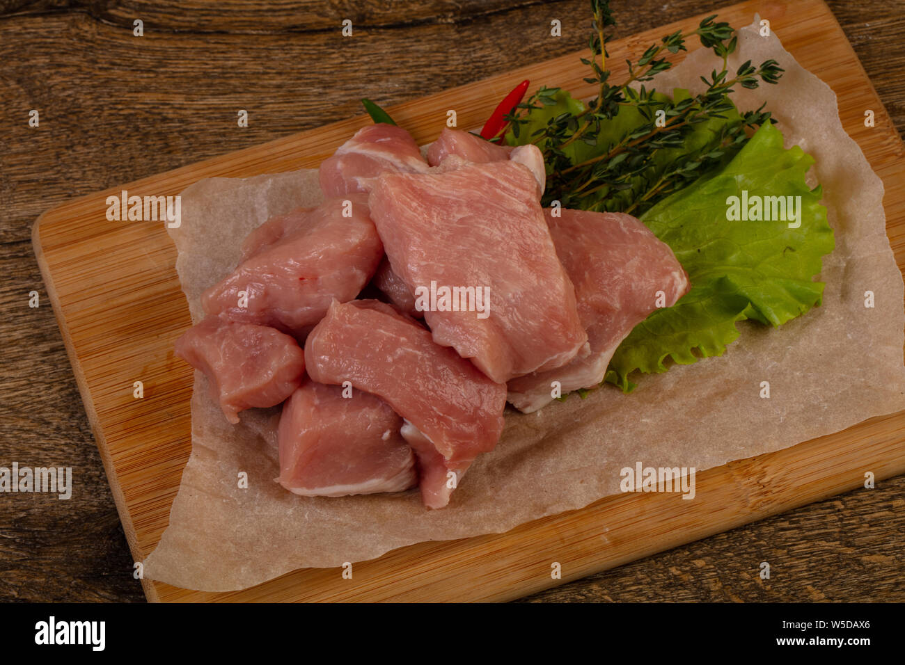 Raw pork meat heap for roast Stock Photo - Alamy