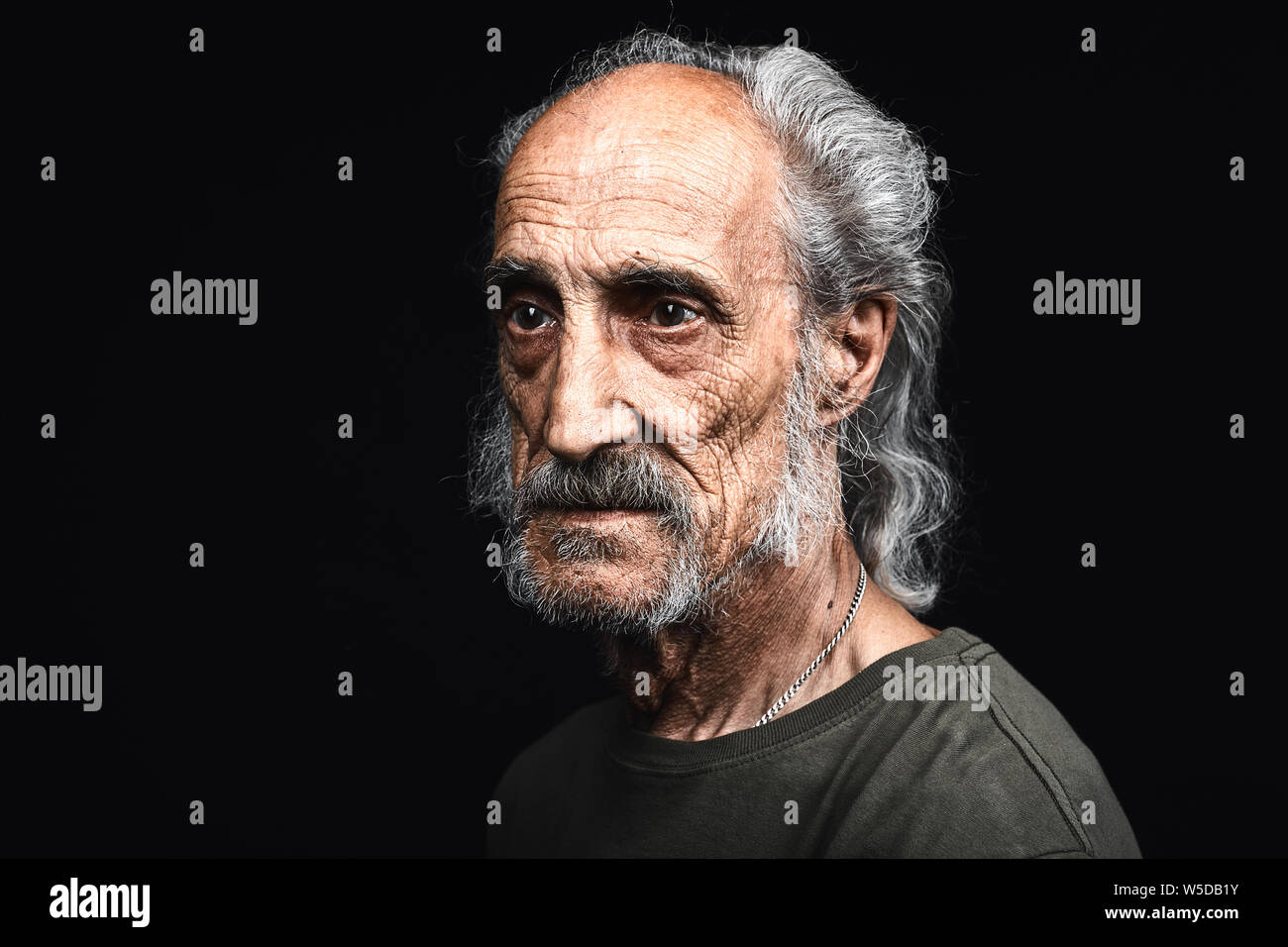 sad tired old man with many wrinkles on his face waiting for death ...