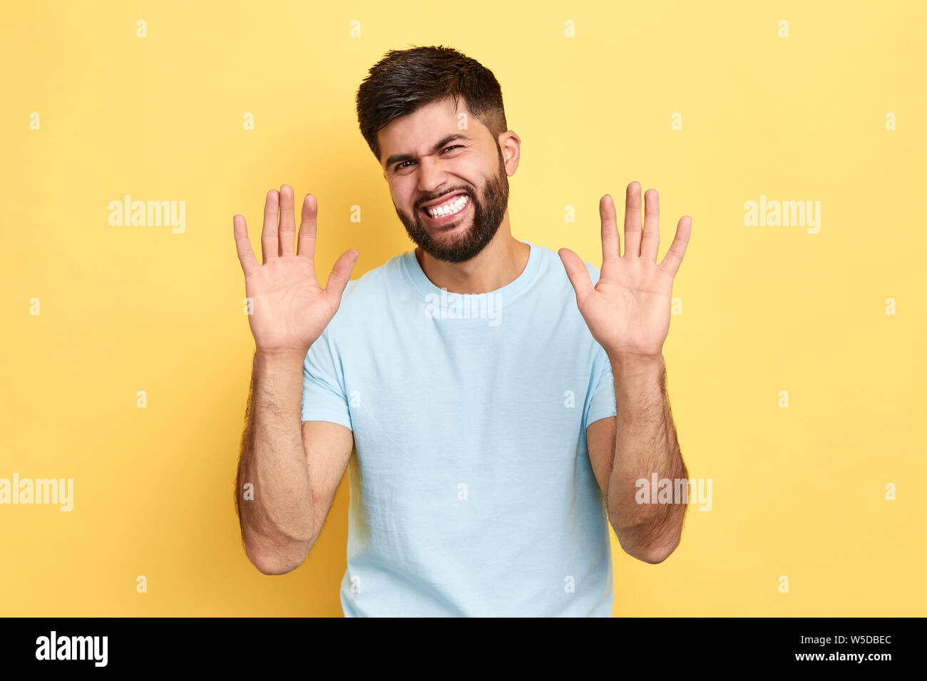 Handsome young emotional man denying, rejecting proposition, refusing ...