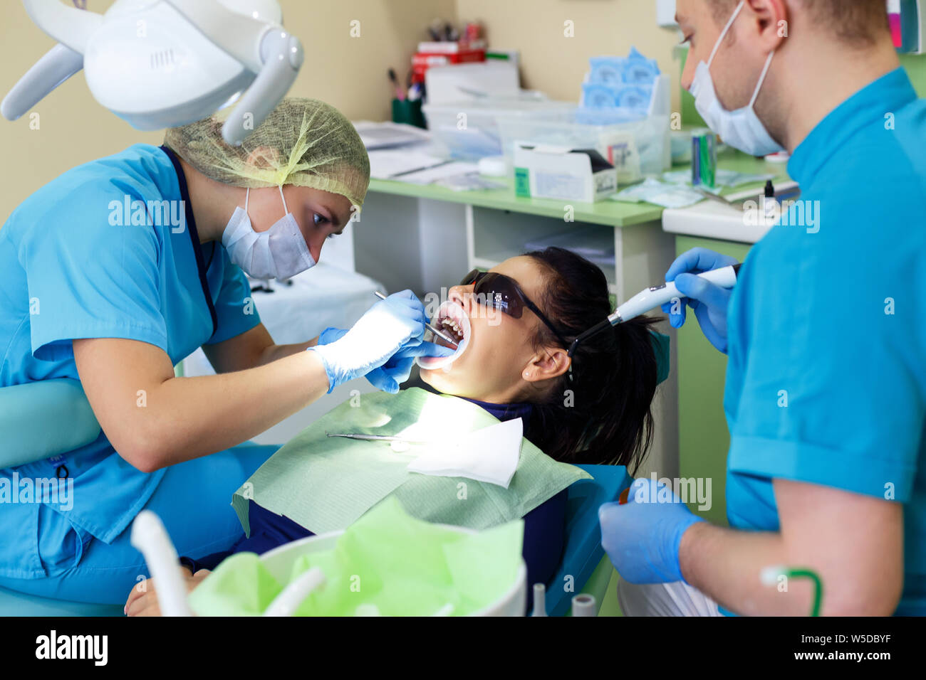 Dentist at work in the office. Close up Stock Photo - Alamy
