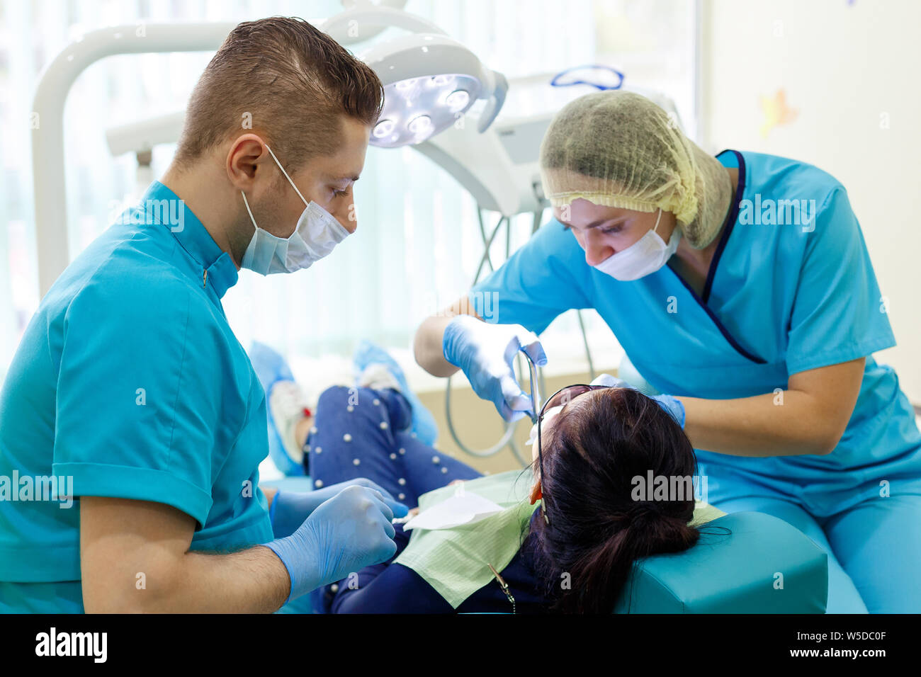 Dentist at work in the office. real operation Stock Photo - Alamy