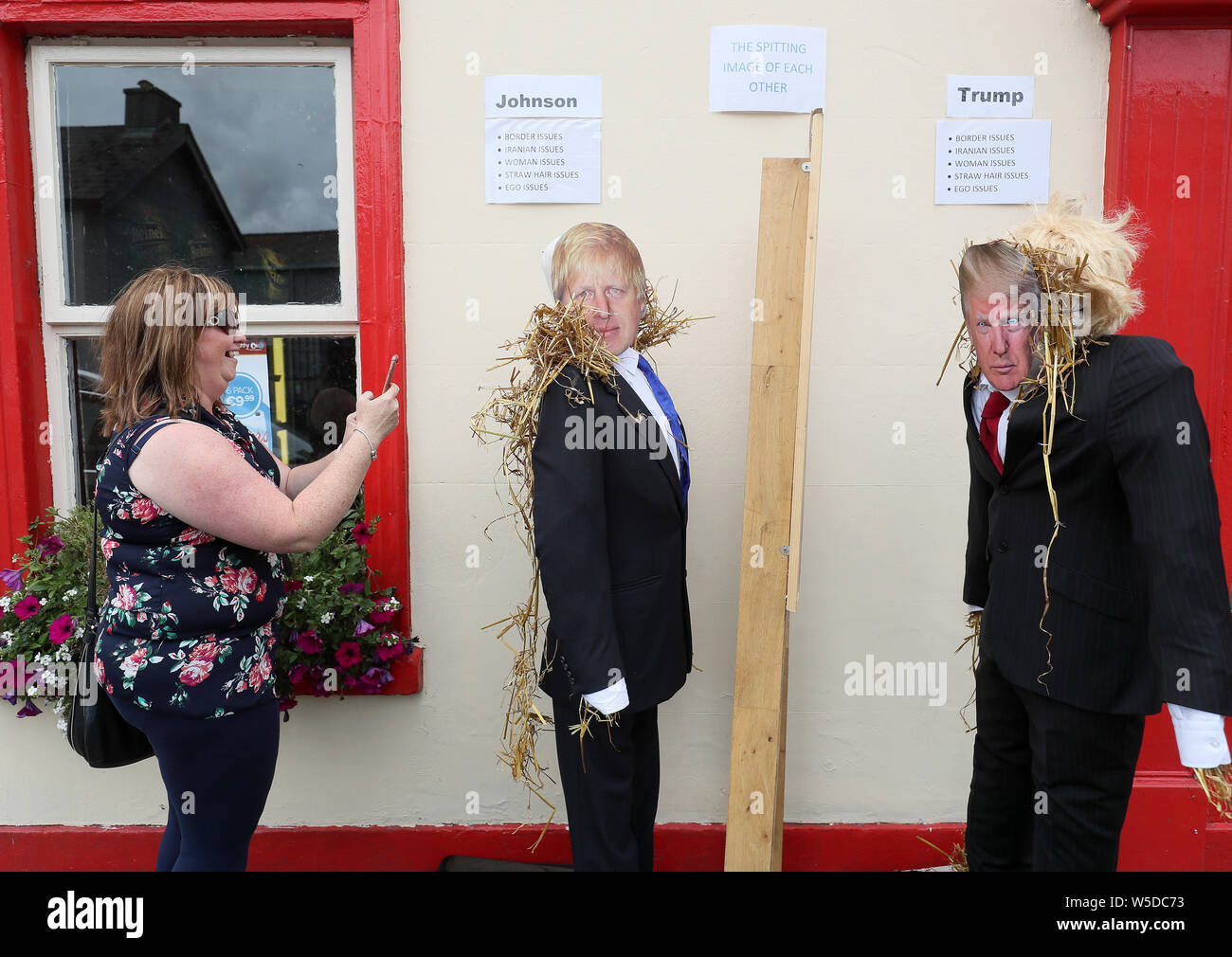 Claire McClafferty, from Laois, takes a photo of scarecrows of Boris ...