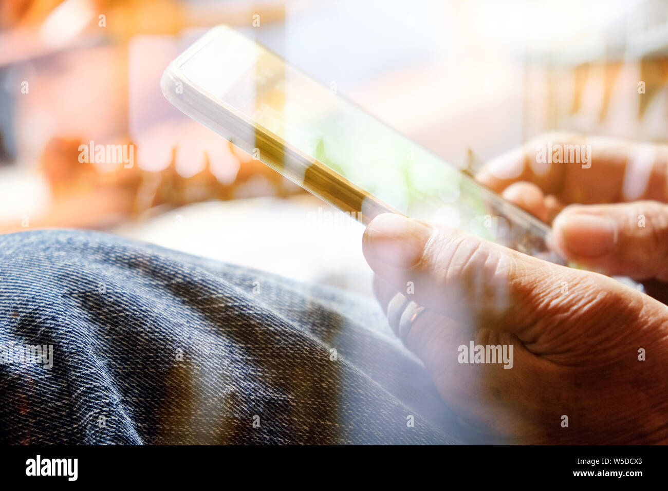 Hands with mobile, double exposure Stock Photo - Alamy