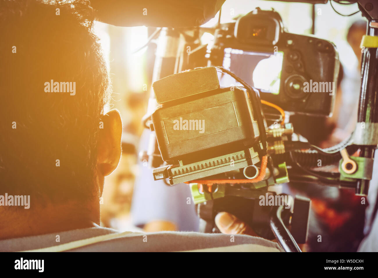 Film industry. cameraman shooting film scene with camera Stock Photo ...