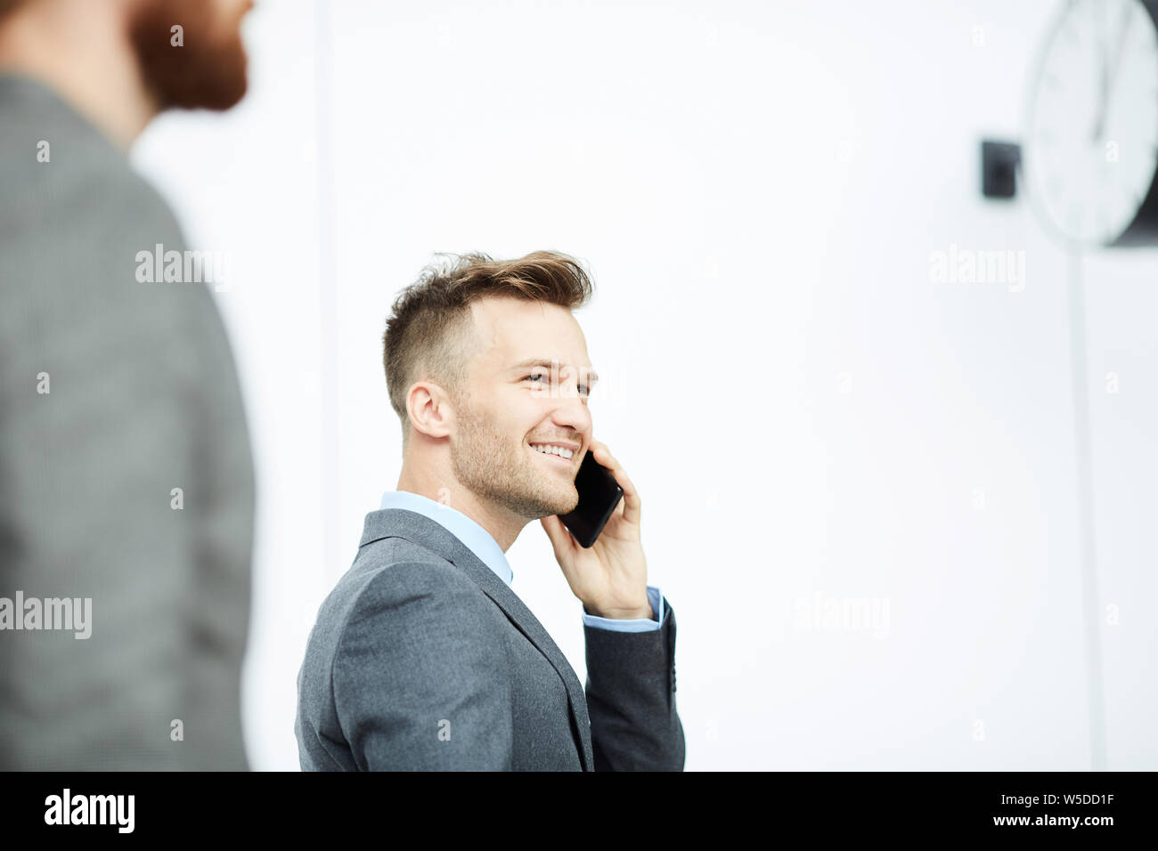 Man talking over phone walking hi-res stock photography and images - Alamy