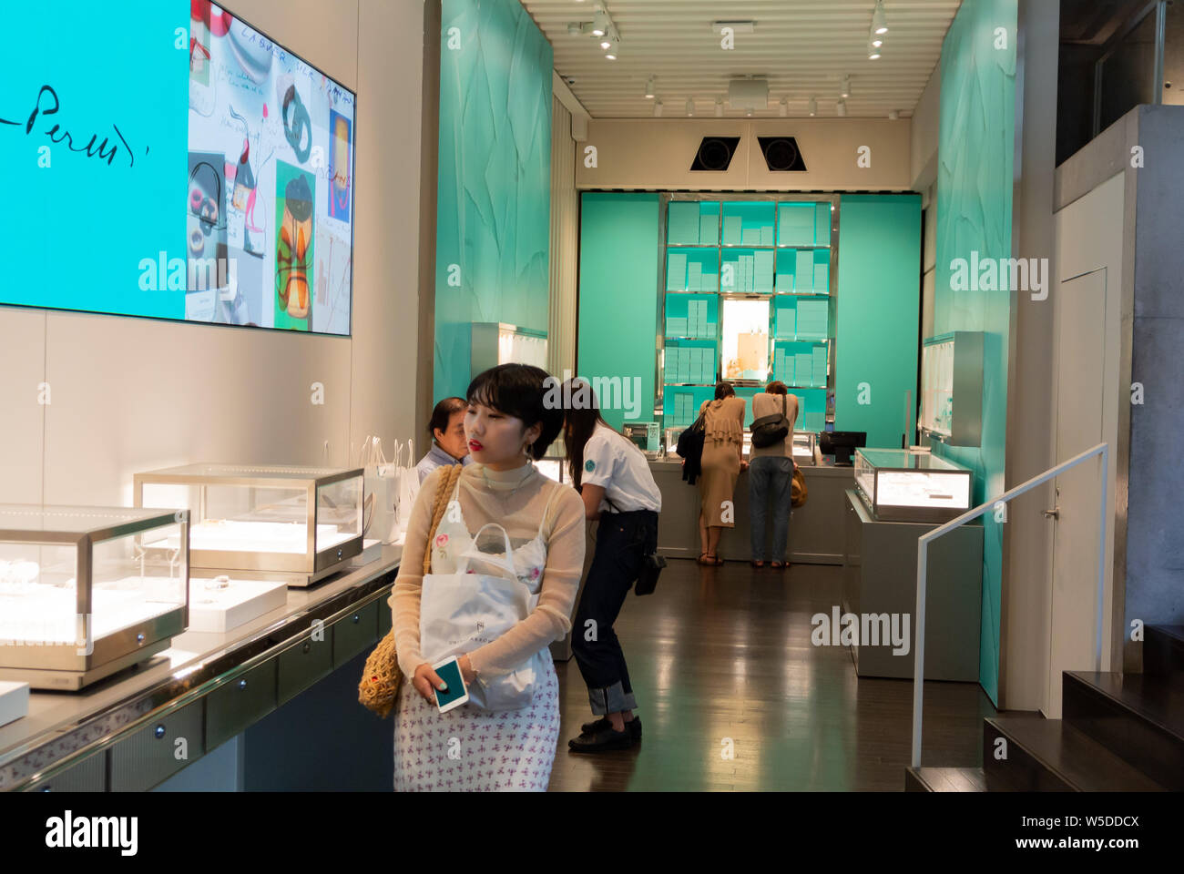 A Japanese woman visiting a flag store of Tiffany&Co in Harajuku cat ...