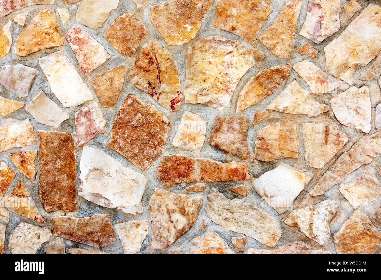 Masonry wall of stones with irregular pattern texture background Stock ...