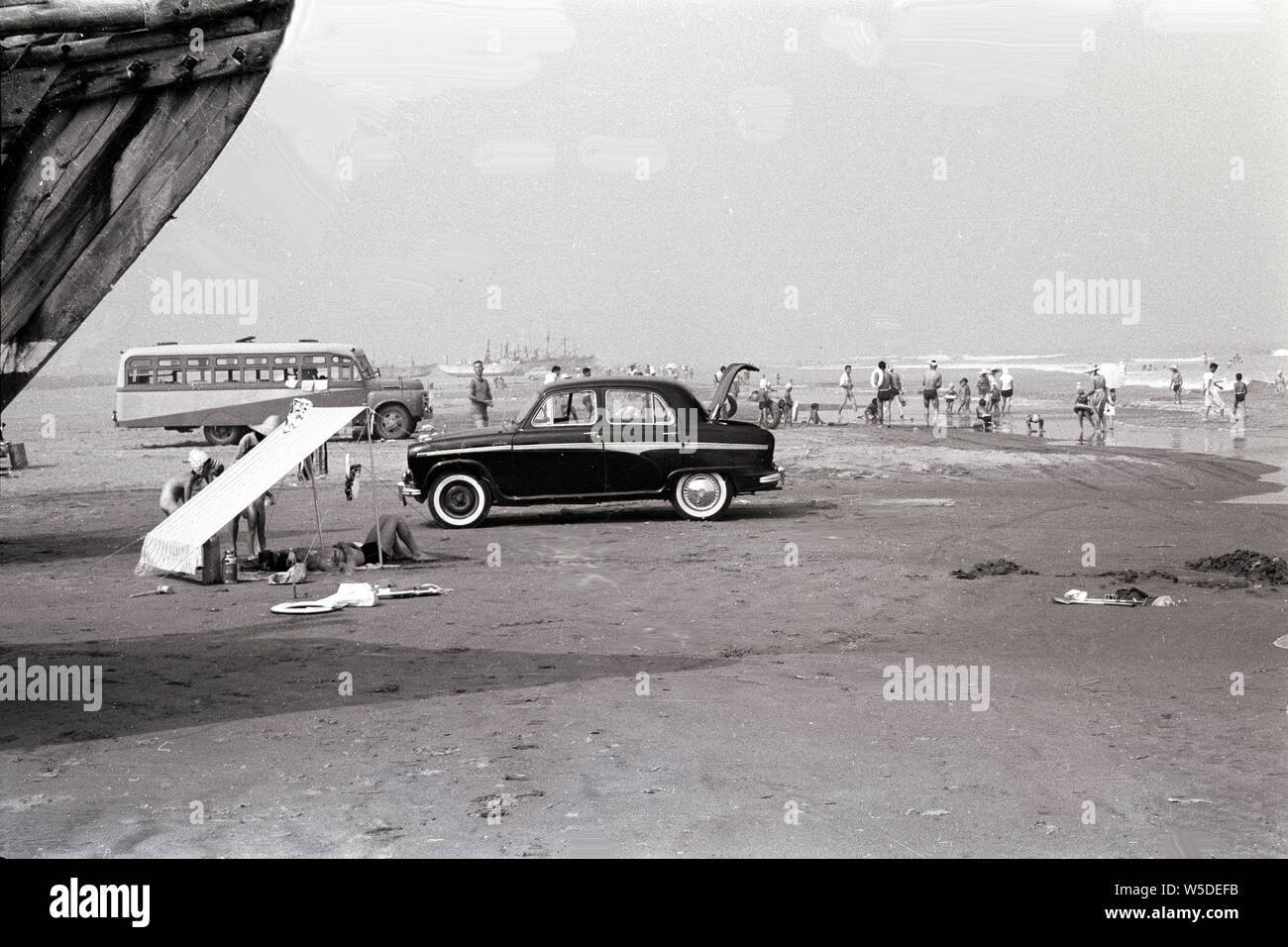 [ 1960s Japan - Car and Bus on a Japanese Beach ] — People relax next ...