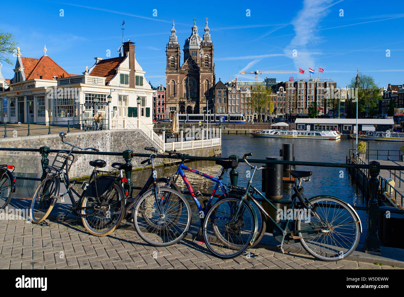 Bikes on the bridge that crosses the canal in Amsterdam, Netherlands ...