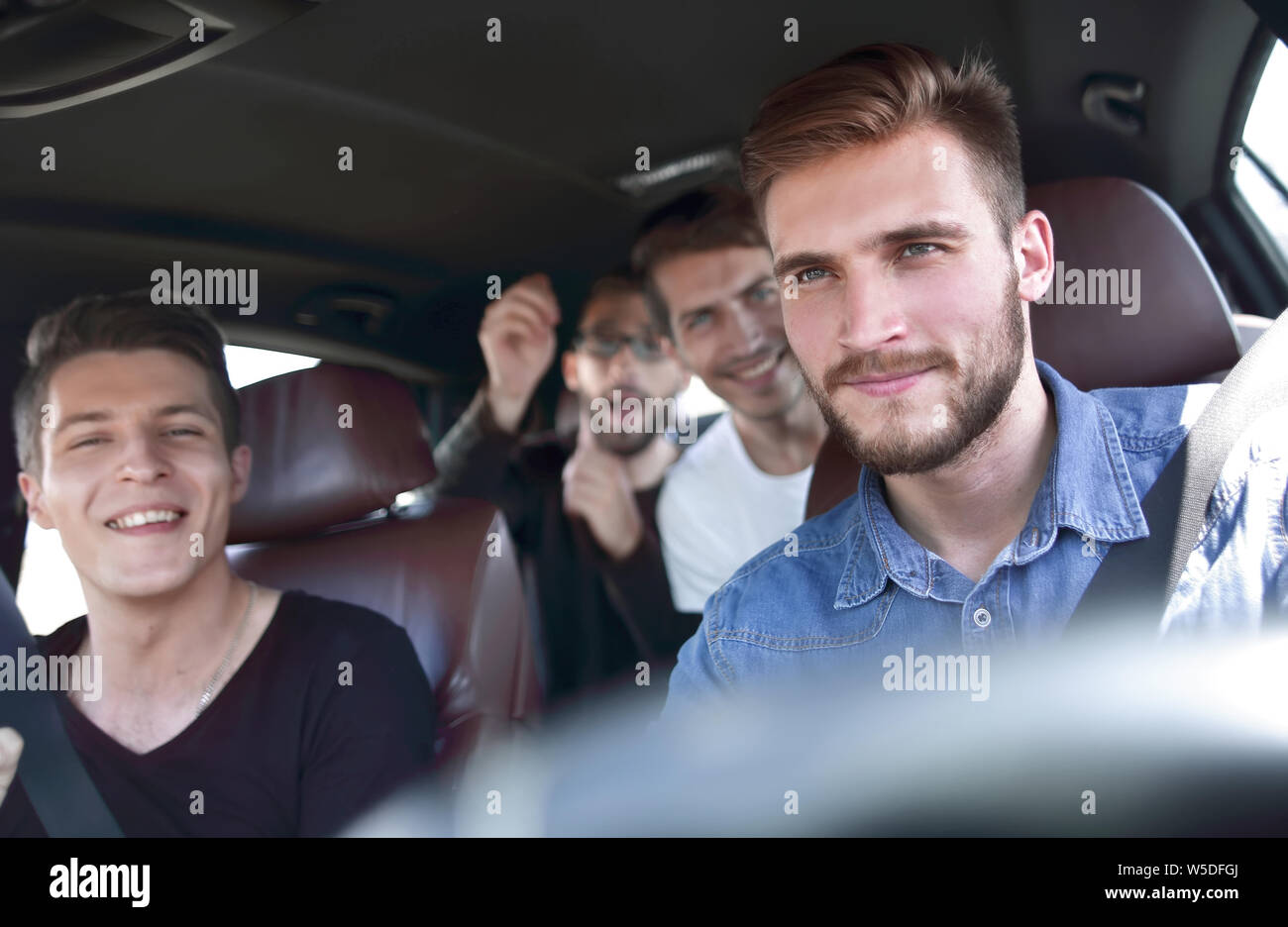 Group of happy friends on a car Stock Photo - Alamy