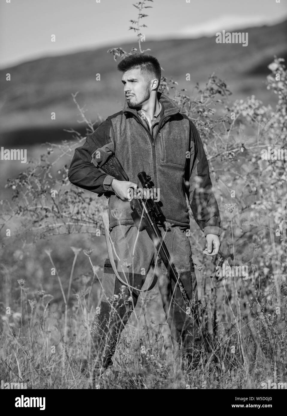 Hunter brutal poacher. Hunter bearded poacher looking for victim ...