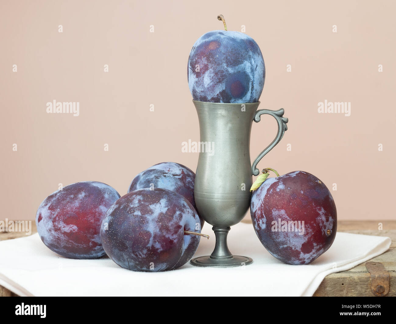Red plums still life. With serviette, napkin and rustic surface Stock ...