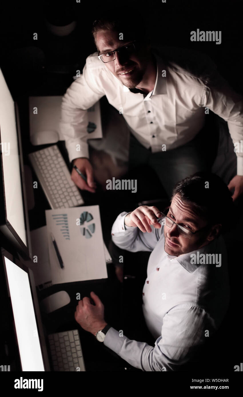 top view .business colleagues sitting at the office Desk Stock Photo ...