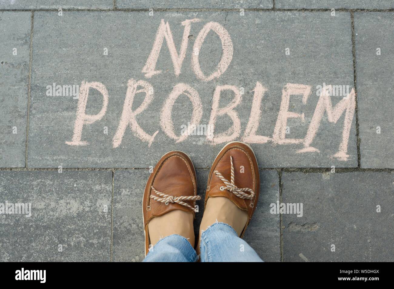 Female feet with text no problem written on grey sidewalk Stock Photo ...