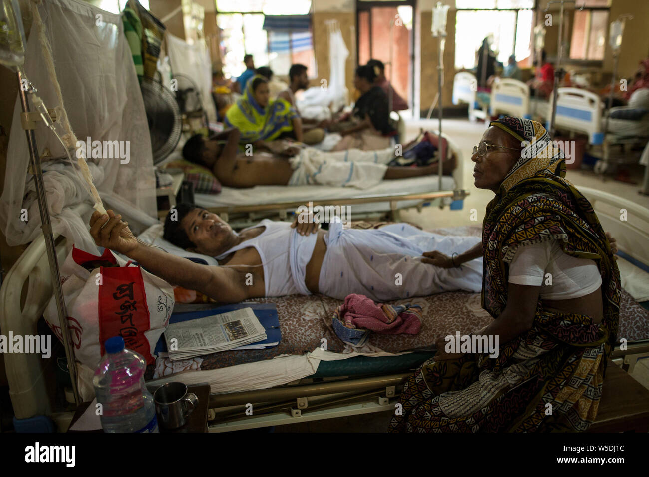 DHAKA, BANGLADESH - JULY 28 : Dengue fever patient receives treatment ...