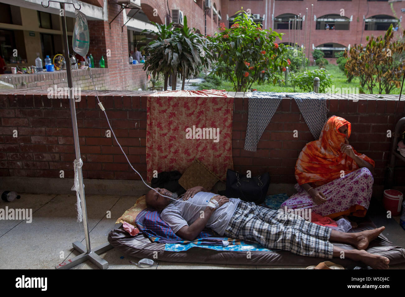 DHAKA, BANGLADESH - JULY 28 : Dengue fever patient receives treatment ...