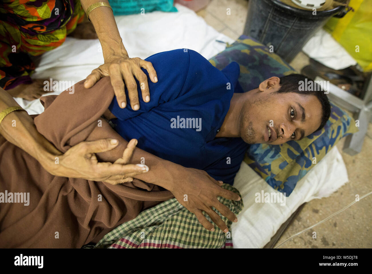 DHAKA, BANGLADESH - JULY 28 : Dengue fever patient receives treatment ...