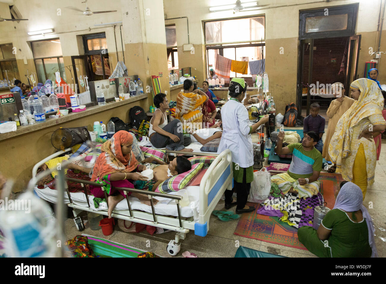 DHAKA, BANGLADESH - JULY 28 : Dengue fever patient receives treatment ...